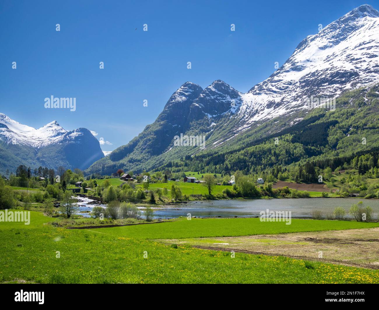 A view of houses along the shore of Lake Oldevatnet, within the ...