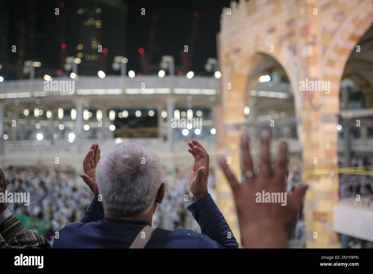 Muslim pilgrim pray while facing the Kaaba, the cubic building at the ...