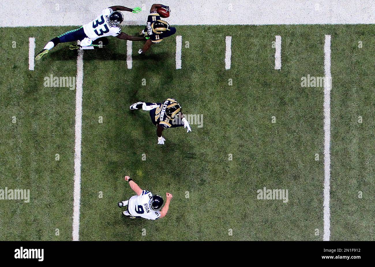 St. Louis Rams' Tavon Austin, top right, stays in bounds as he runs ...