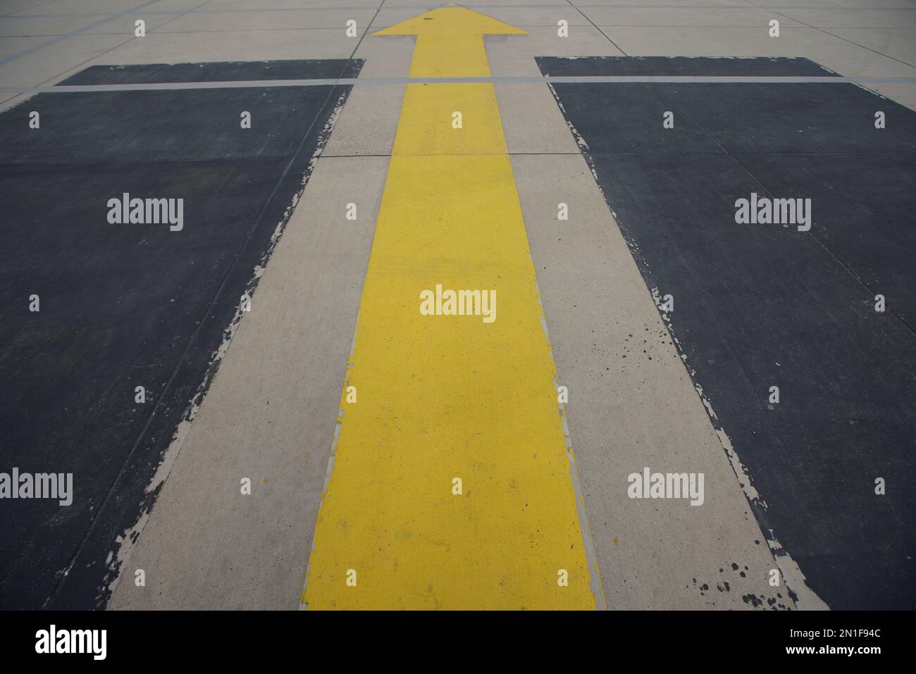 Yellow Arrow Destination sign in an Airport Stock Photo - Alamy