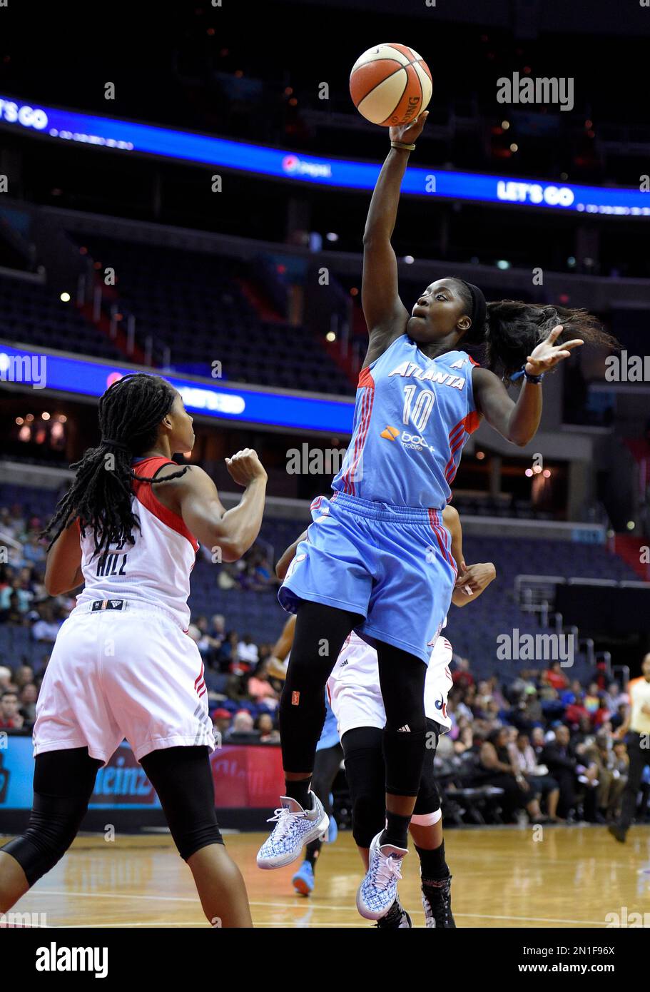 Atlanta Dream guard Matee Ajavon (10) puts up a shot against Washington ...