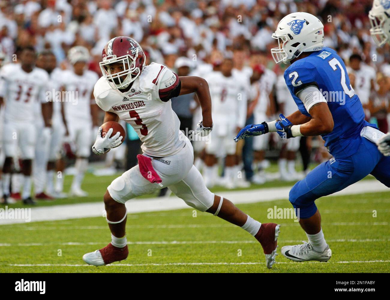 New Mexico State running back Larry Rose III (3) runs for yardage past ...