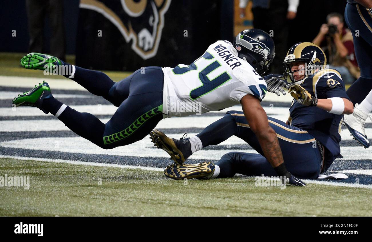 St. Louis Rams quarterback Nick Foles, right, scores on a 1-yard run ...