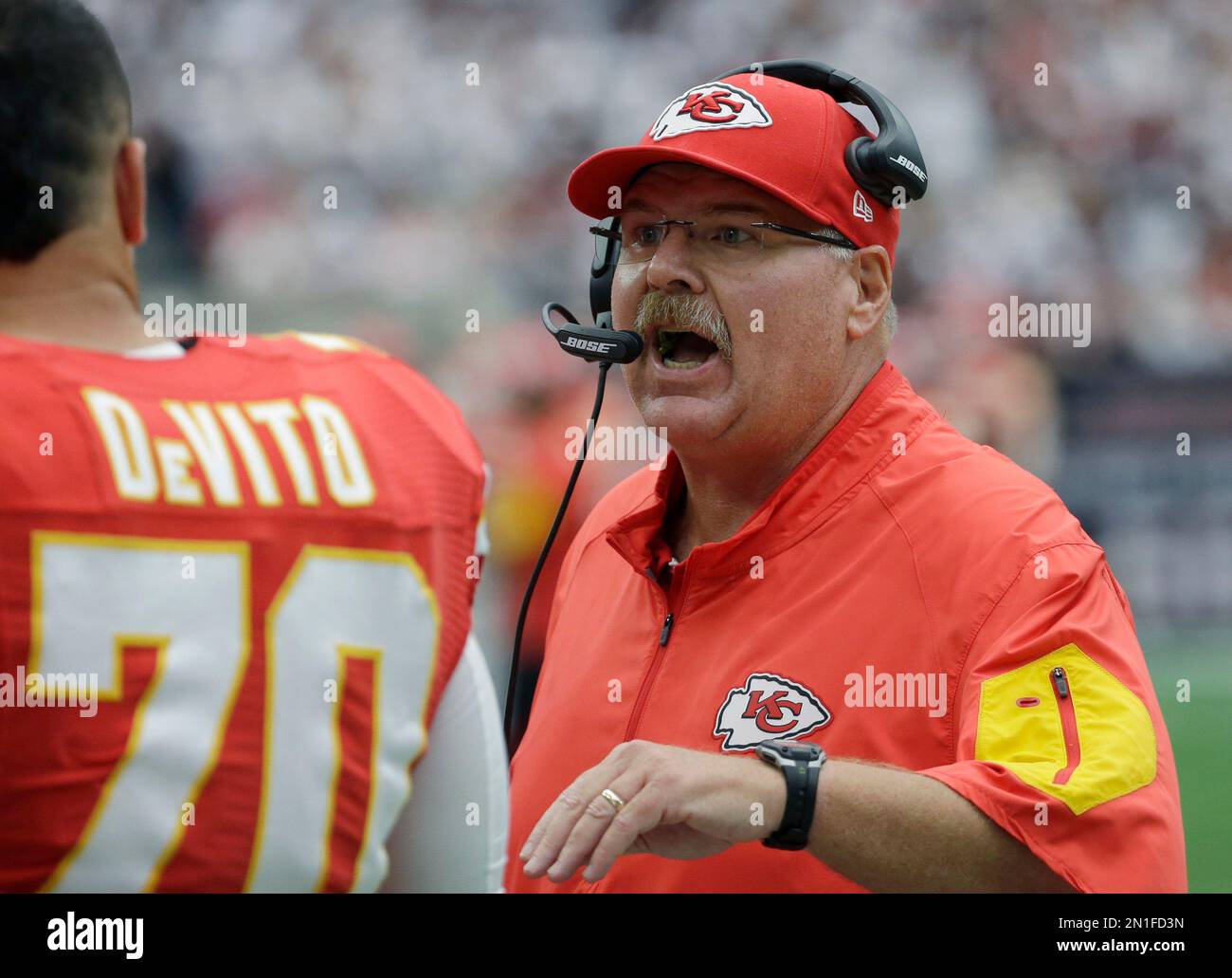 Kansas City Chiefs head coach Andy Reid talks with Mike DeVito (70) during the first half of an ...