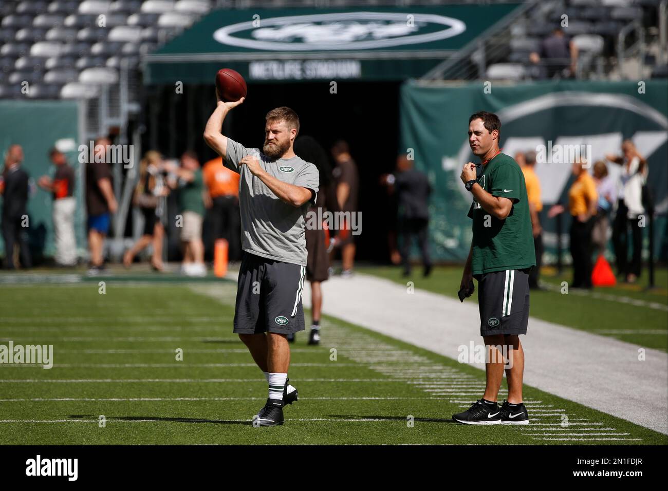 New York Jets quarterback Ryan Fitzpatrick throws a pass before an NFL ...