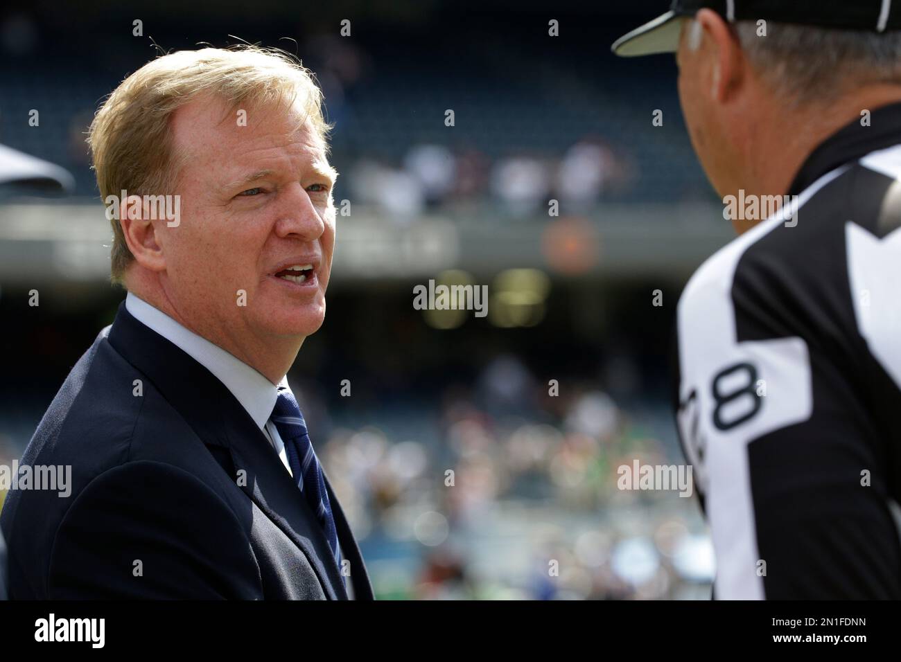 NFL Commissioner Roger Goodell talks with head linesman Mark Hittner ...