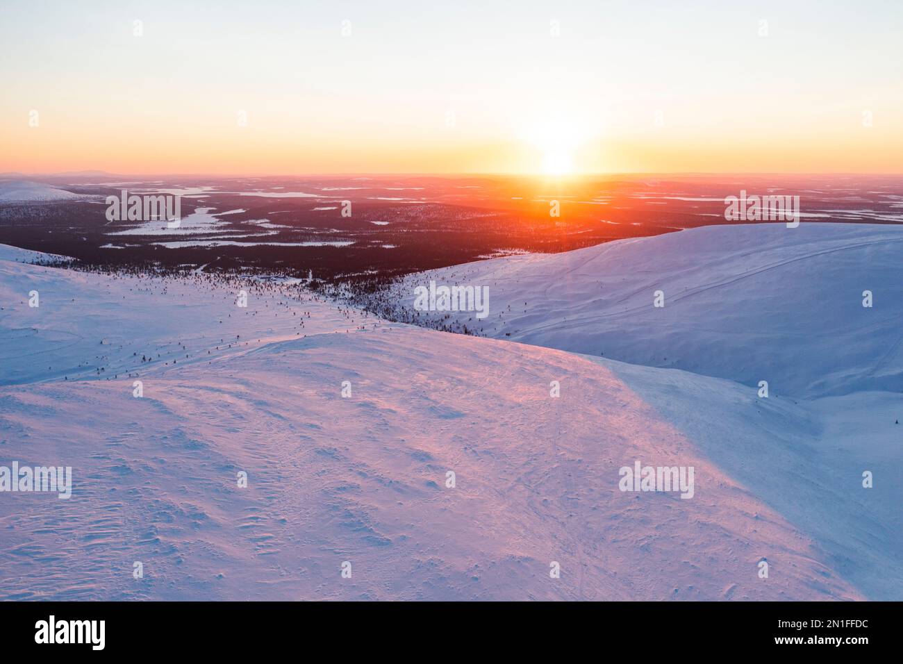 Majestic mountains covered with snow at sunset, Pallas-Yllastunturi ...