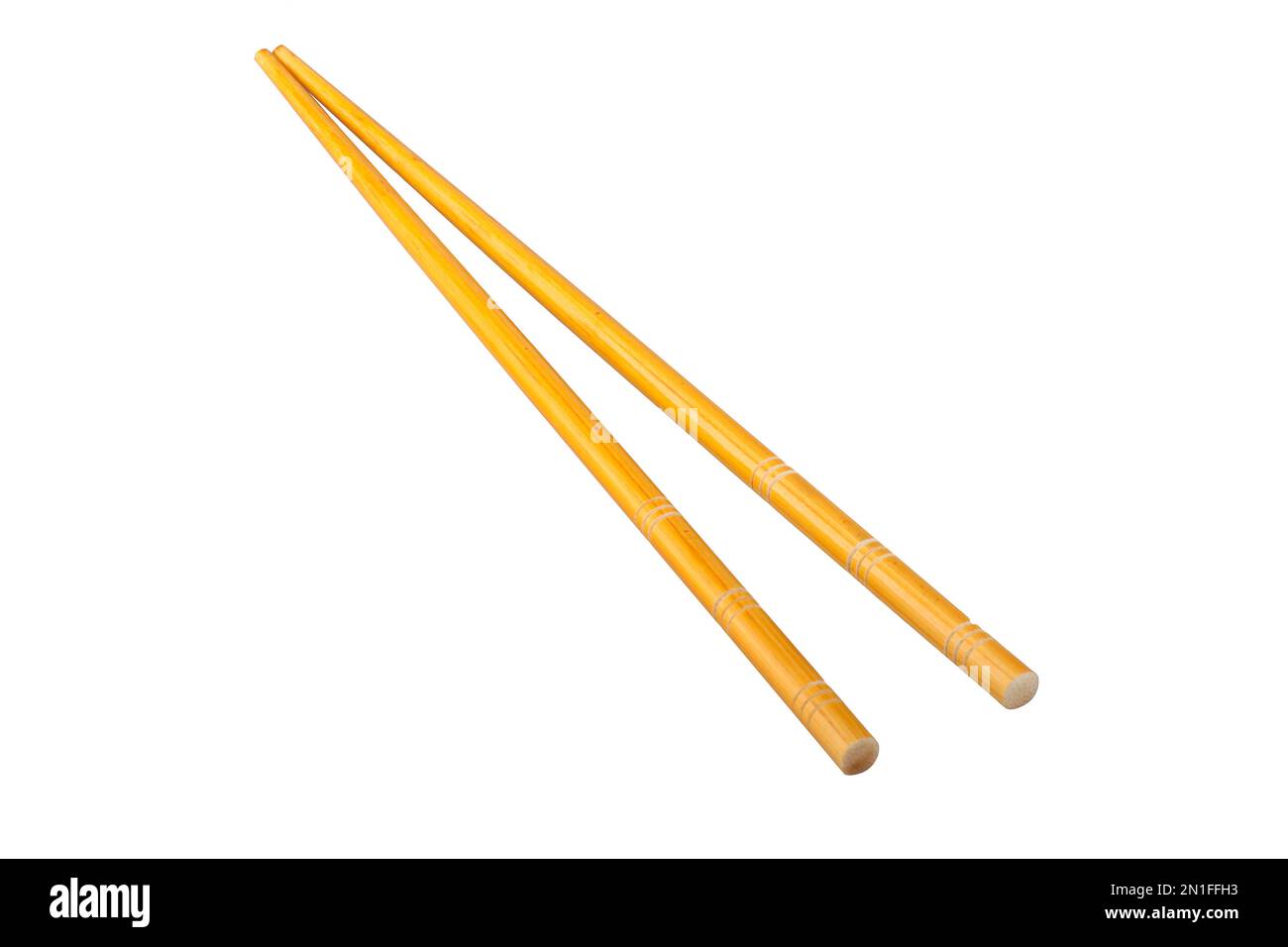 Yellow wooden chopsticks isolated on white background Stock Photo - Alamy