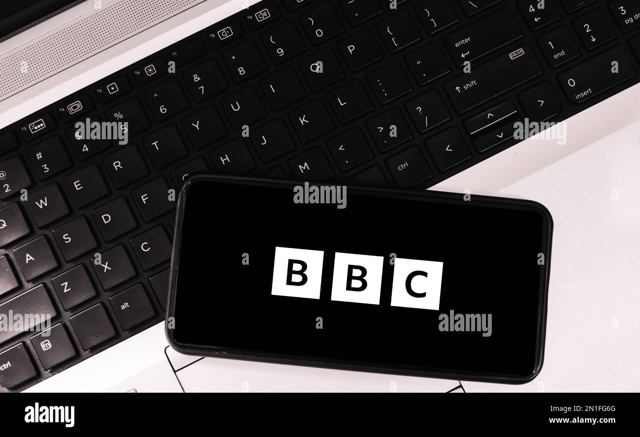 BBC news on mobile screen editorial background with black backdrop ...