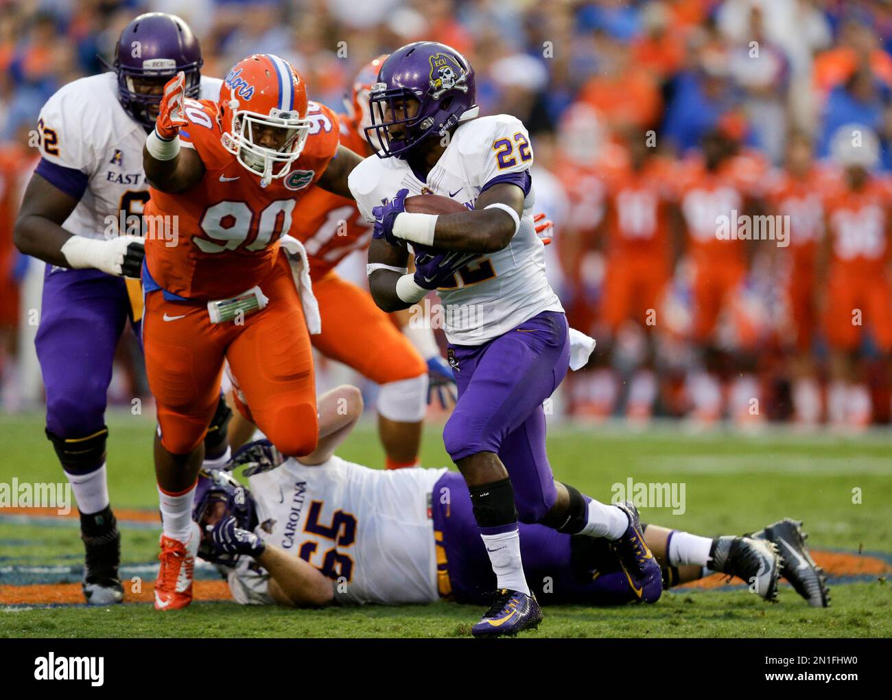East Carolina running back Chris Hairston (22) runs past Florida ...