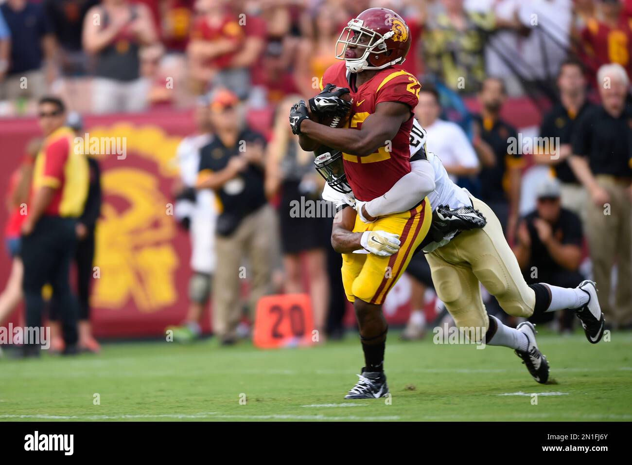 Southern California running back Justin Davis (22) is taken down by ...