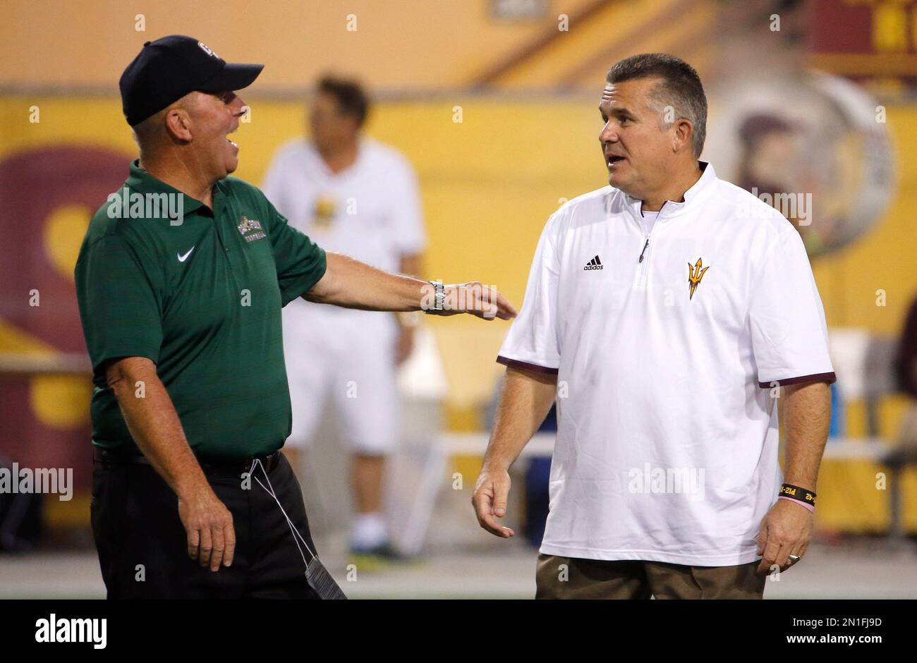 Arizona State coach Todd Graham, right, talks with Cal Poly coach Tim ...
