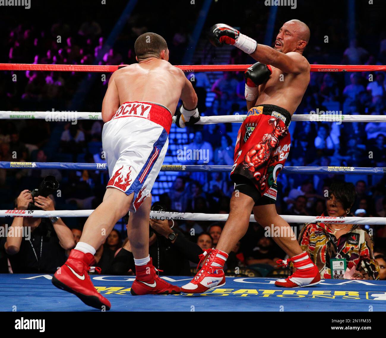 Roman Martinez, left, hits Orlando Salido during their junior ...