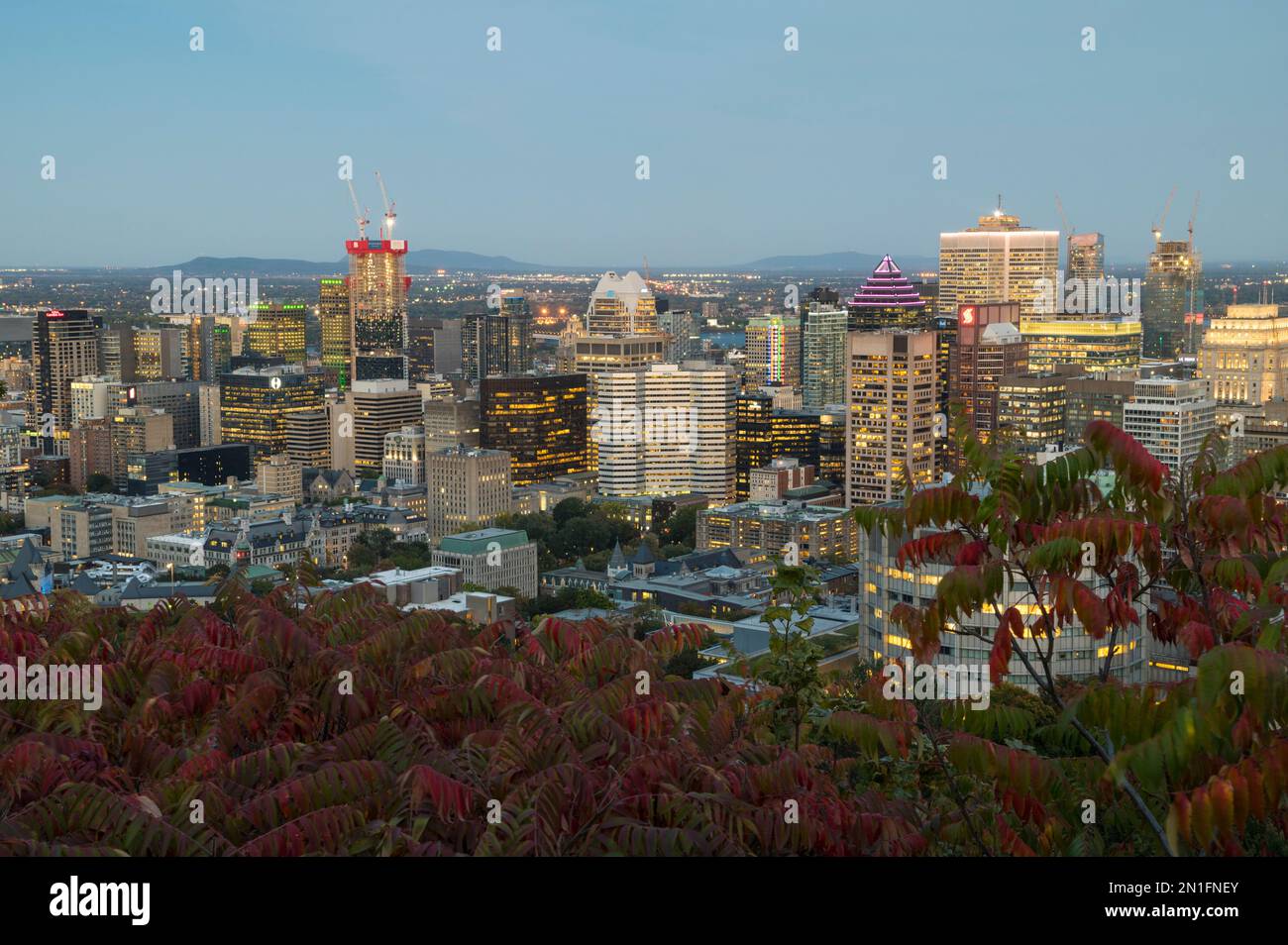 View of Montreal city skyline from Mont Royal Park in autumn at sunset ...