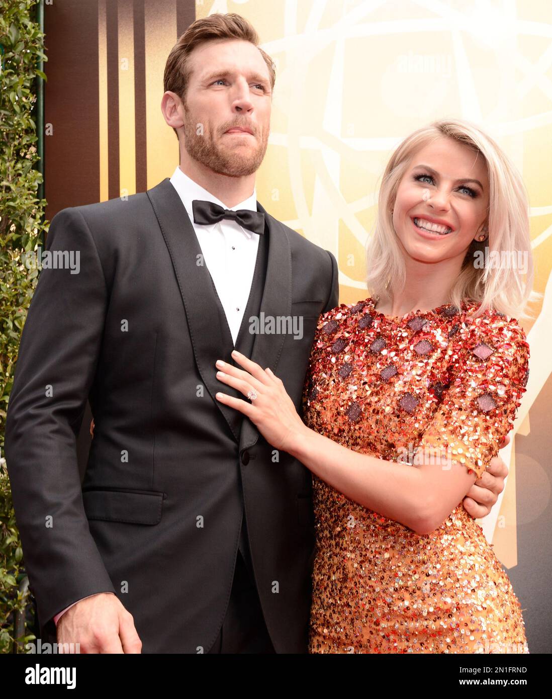 Brooks Laich, left and Julianne Hough arrive at the Television Academy ...