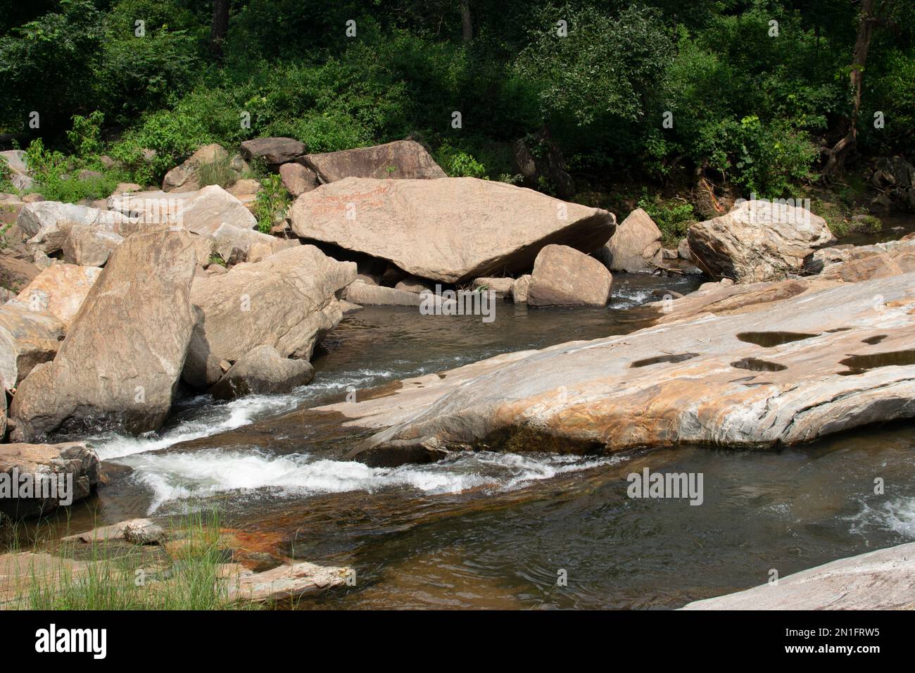 clear water stream near mirchiya falls Stock Photo - Alamy