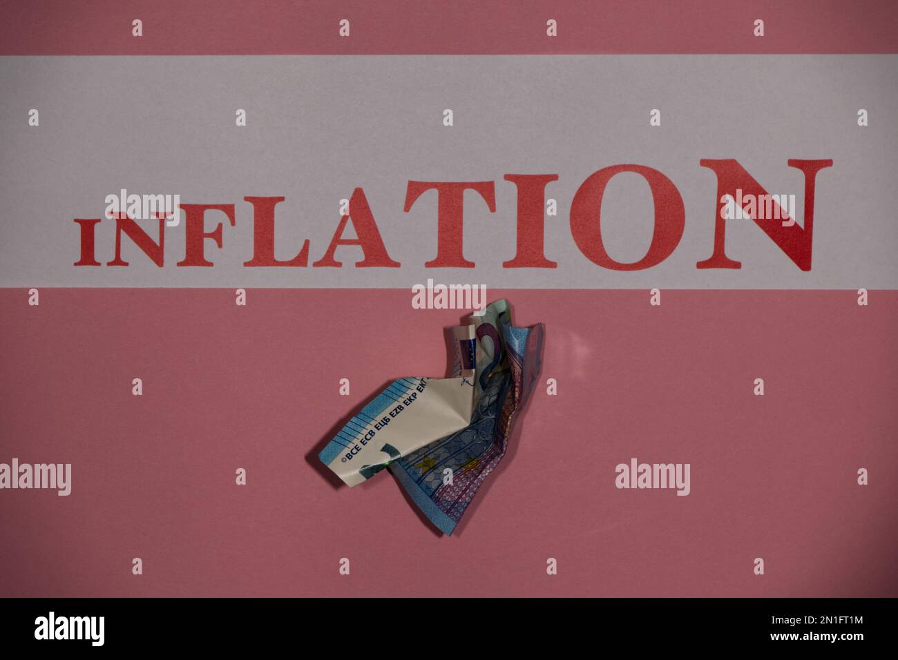 Crumpled 20 Euro banknote on antique pink background and lettering of ...