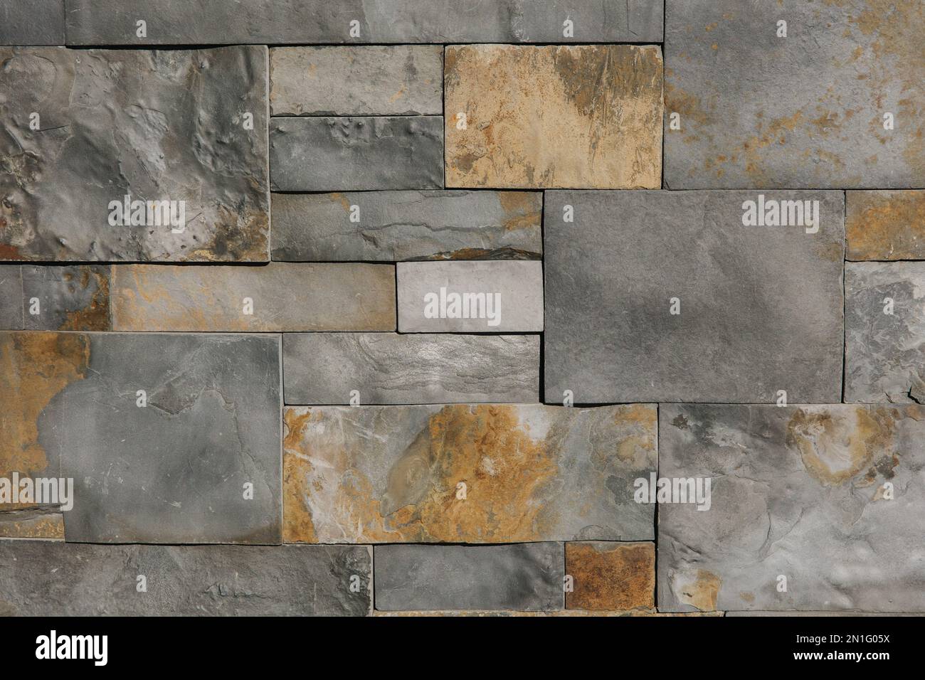 Different size cut out gray marble wall texture Stock Photo - Alamy
