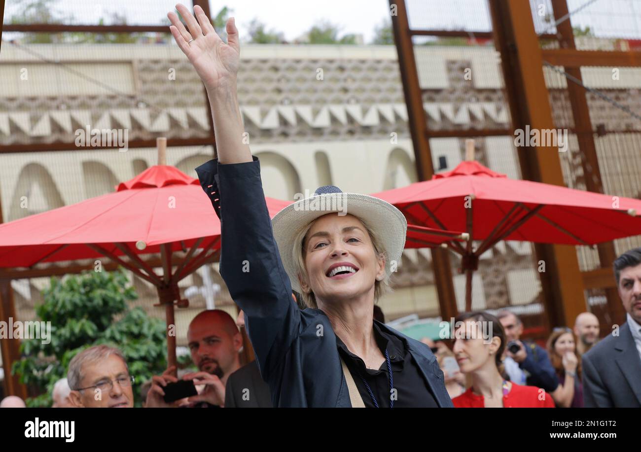 Actress Sharon Stone waves to visitors as she arrives at the Save the ...