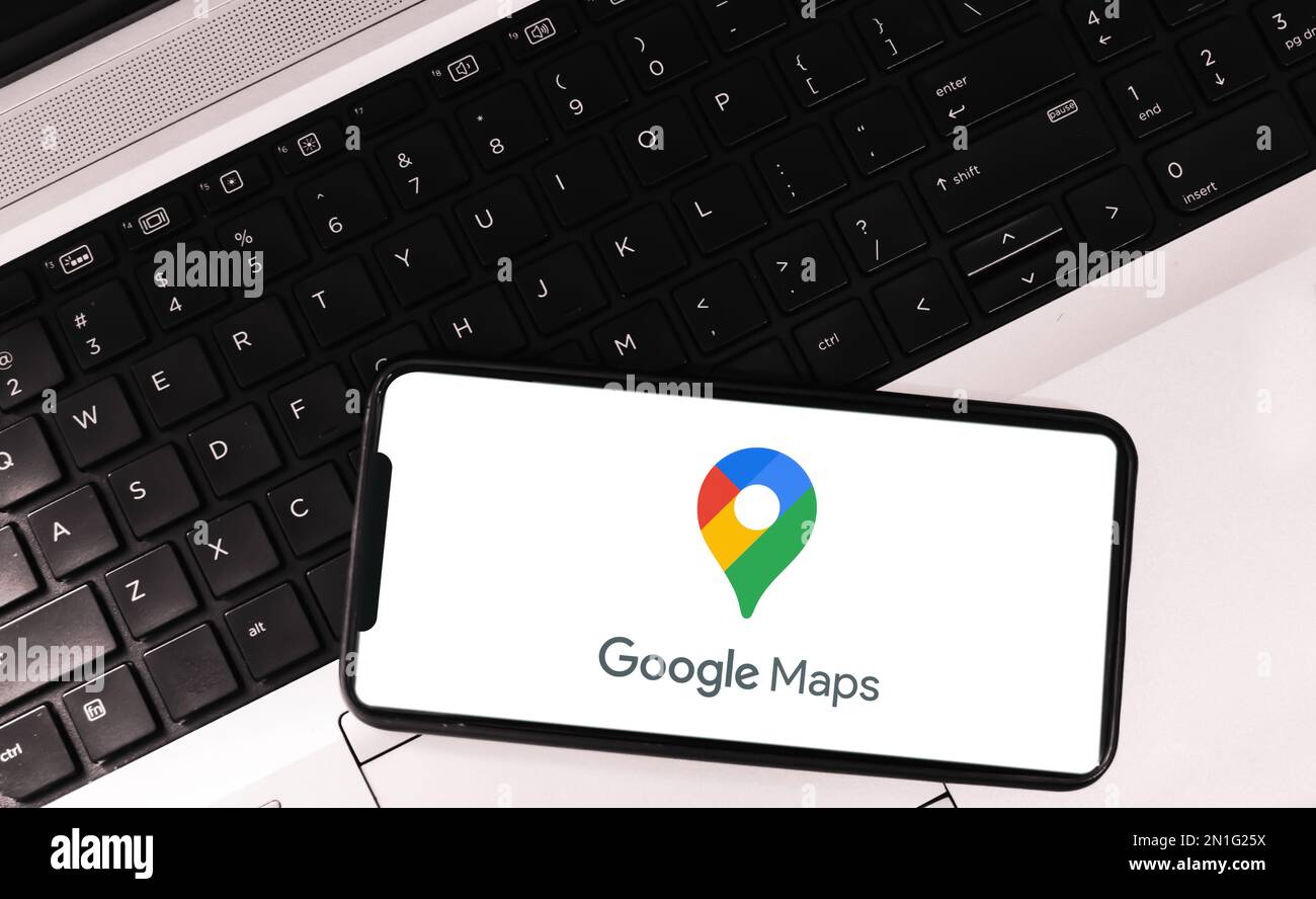 Google Map mobile application with laptop in the backdrop, editorial ...