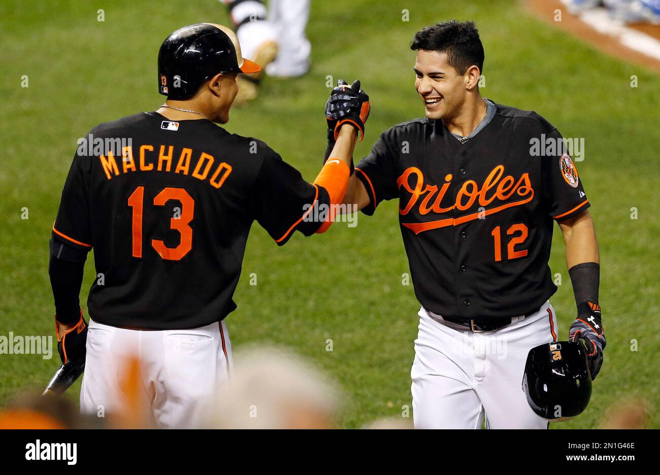 Baltimore Orioles' Dariel Alvarez, right, celebrates his solo home run ...