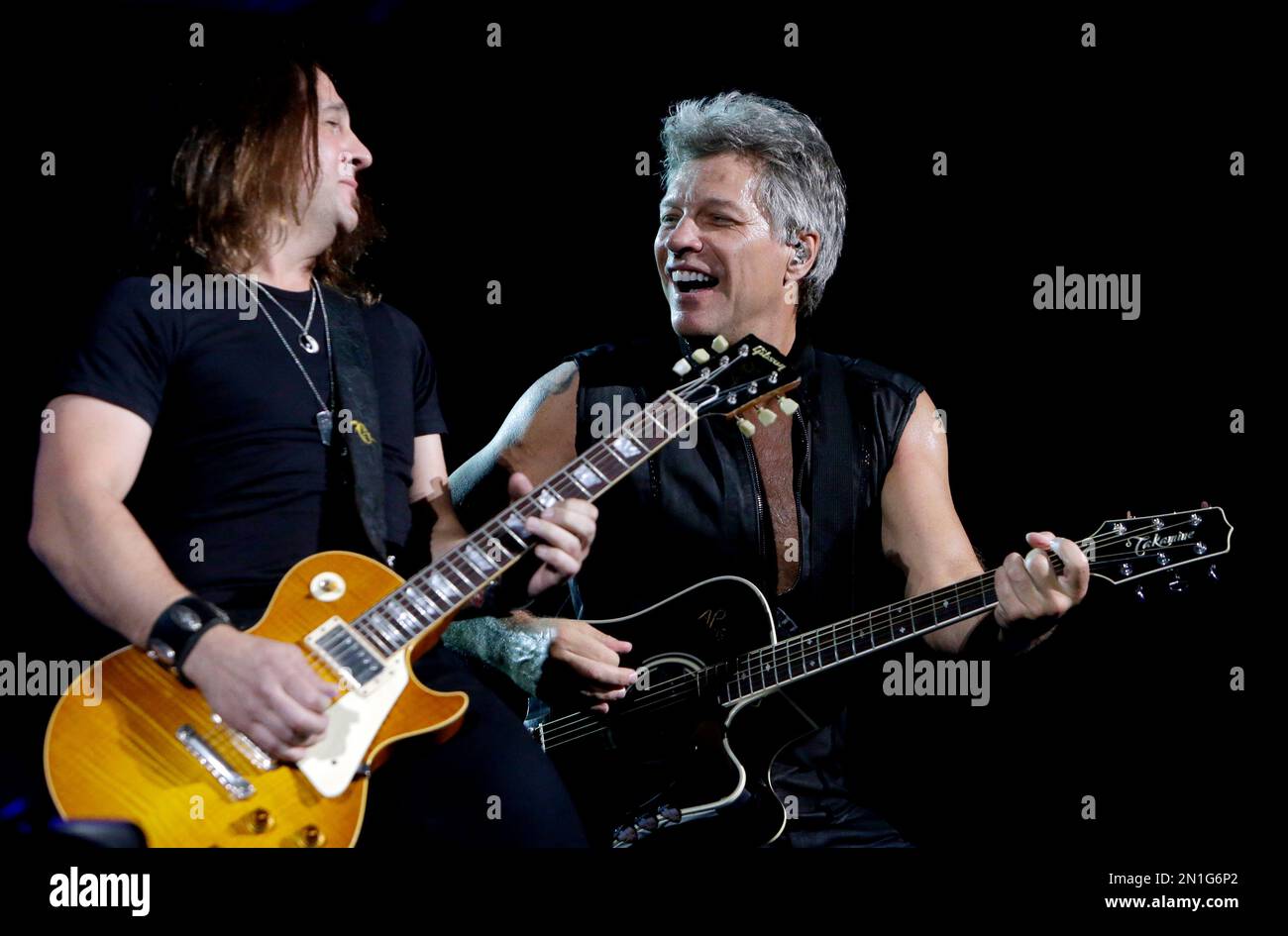 Bon Jovi's lead singer Jon Bon Jovi, right, and guitarist Matt O’Ree ...