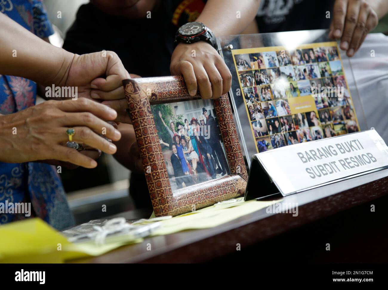Police officers arrange personal belongings of Japanese murder victim Yoshimi Nishimura ...