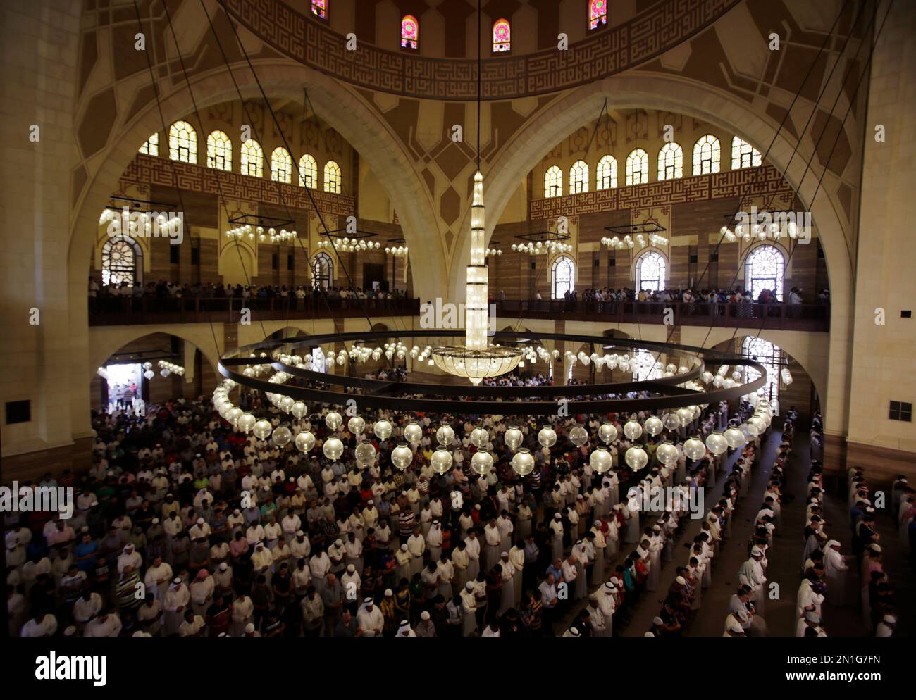 Men pray at Al-Fateh Grand Mosque in Manama, Bahrain, Friday, Sept. 11 ...