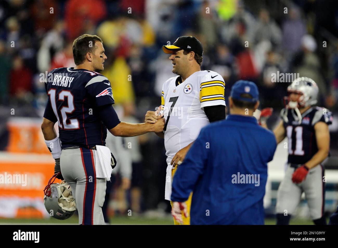 New England Patriots quarterback Tom Brady, left, speaks with ...