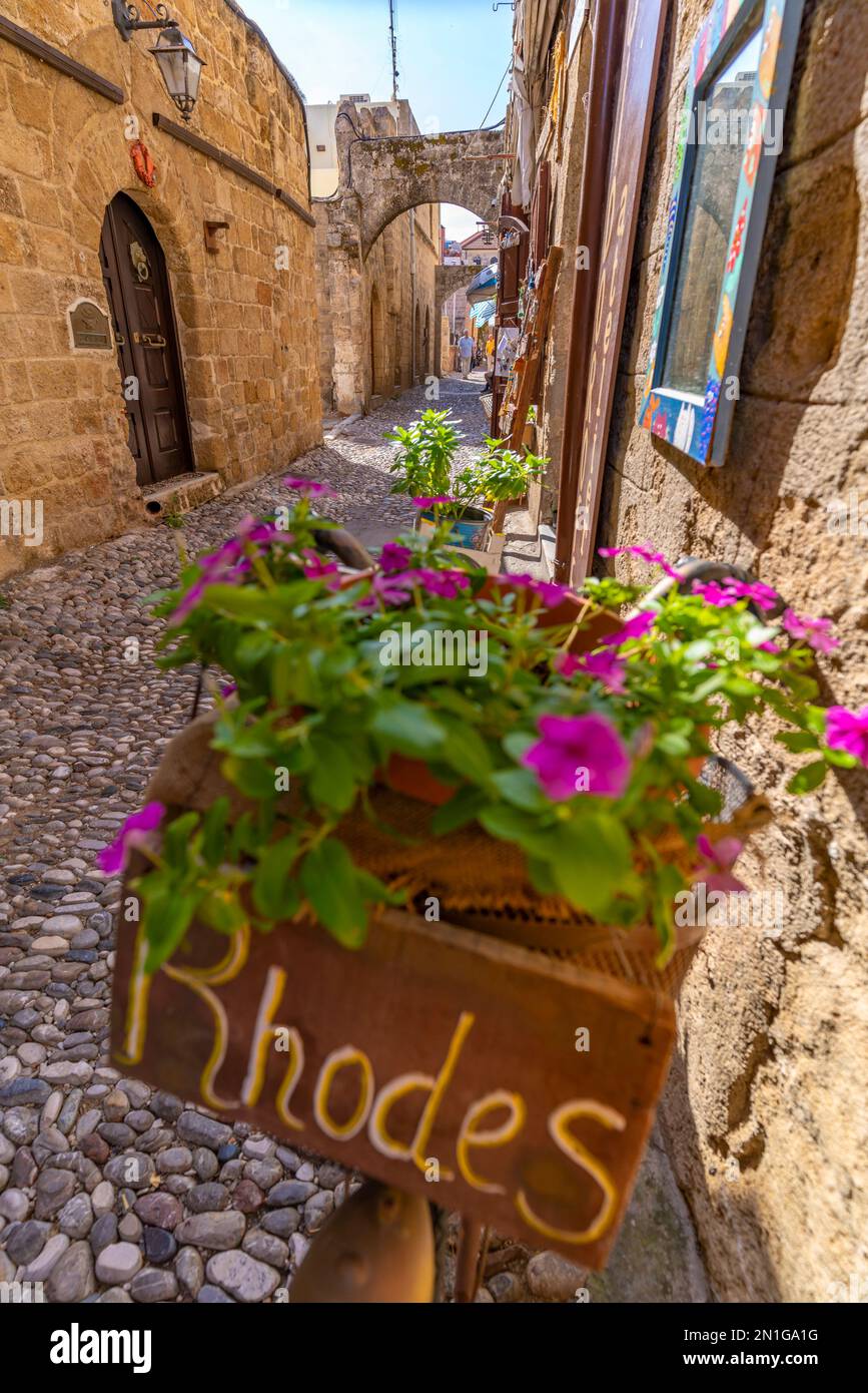 View of Rhodes sign in narrow cobbled street, Old Rhodes Town, UNESCO ...