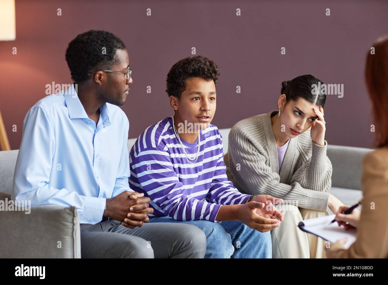 Teenage boy complaining to psychologist about his parents Stock Photo ...