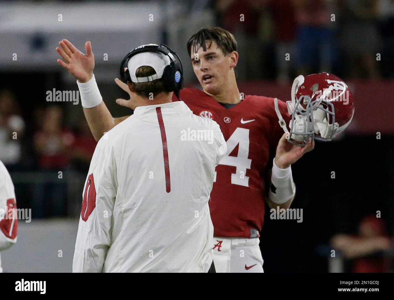 Alabama quarterback Jake Coker (14) taks with coaching staff on the ...