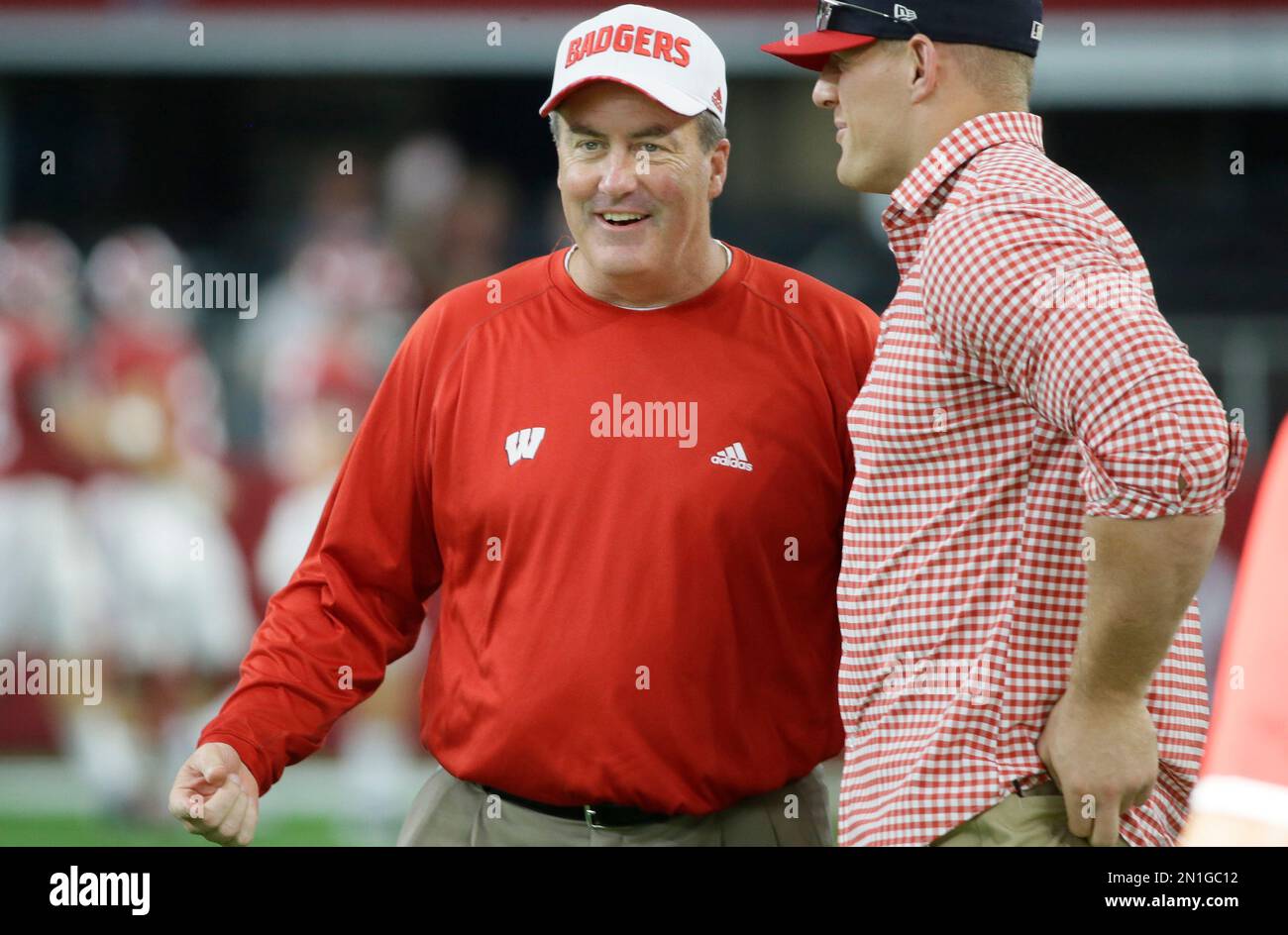 Wisconsin head coach Paul Chryst, left, chats with Houston Texans J.J ...