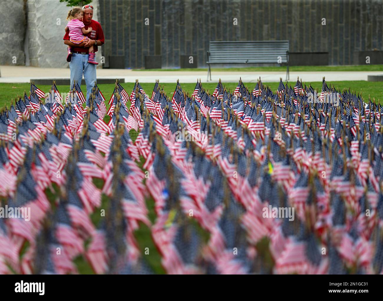 Retired Charlotte Fire Department Capt. Tony Bateman holds his niece ...