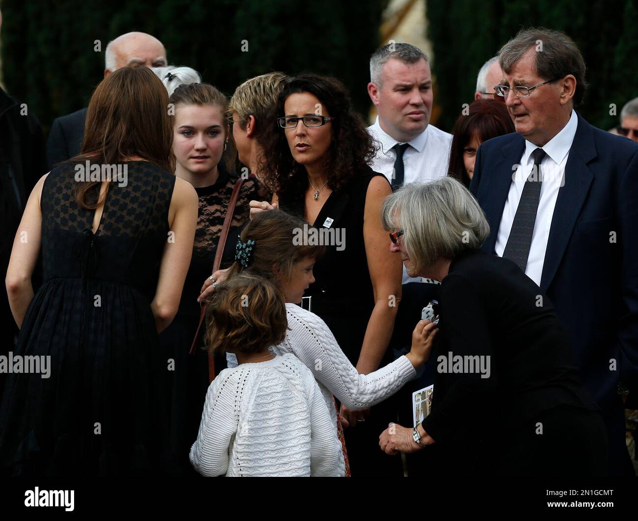 Julia Wilson, centre, wife of racing driver Justin Wilson, with her two ...