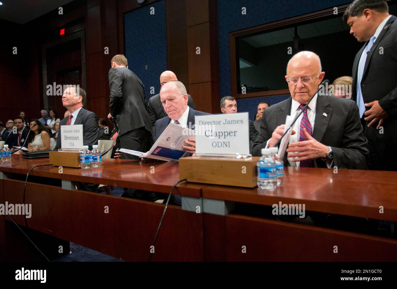 From left, FBI Director James Comey, CIA Director John Brennan, and ...