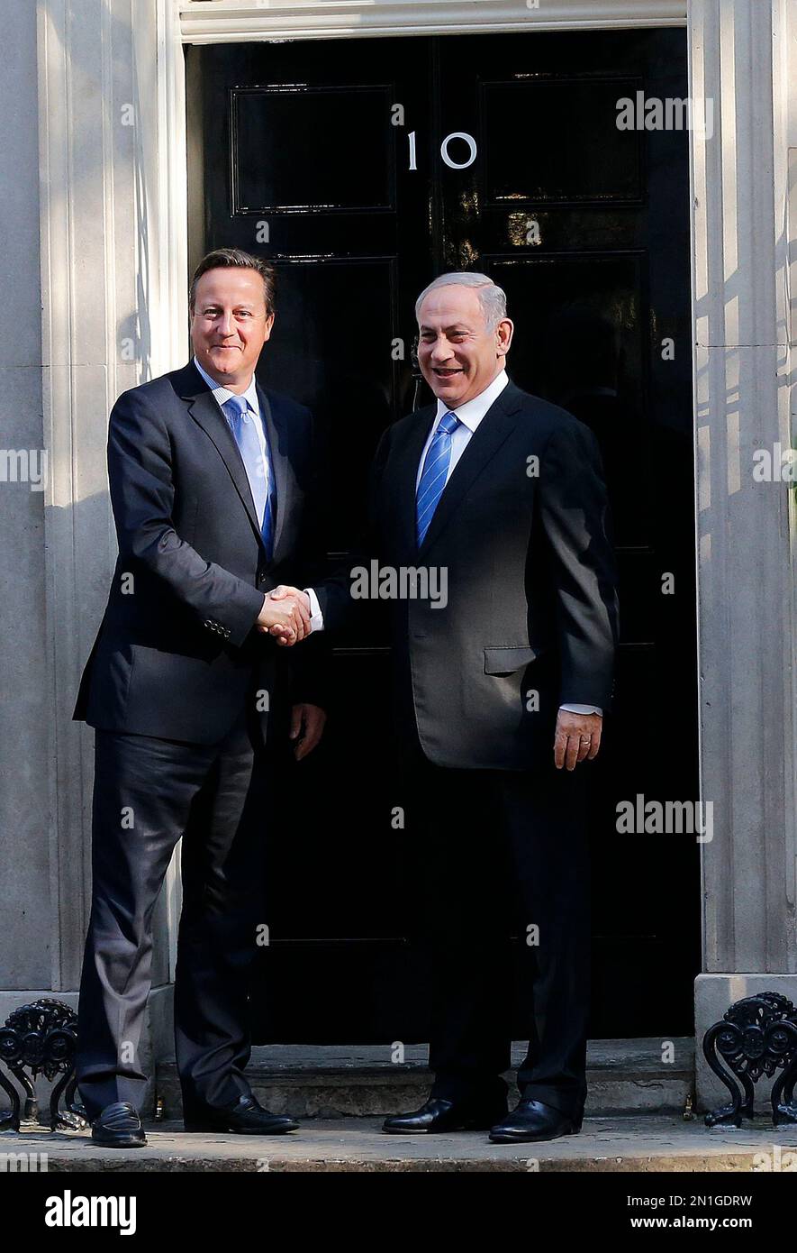 British Prime Minister David Cameron, left, poses as he welcomes his ...