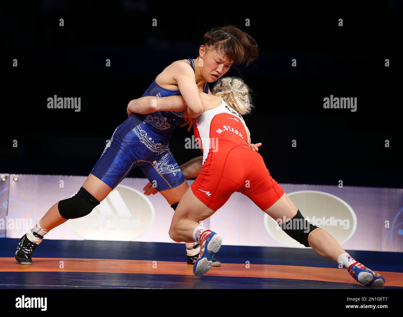 Eri Tosaka, left, of Japan, wrestles Mariya Stadnyk, of Azerbaijan ...