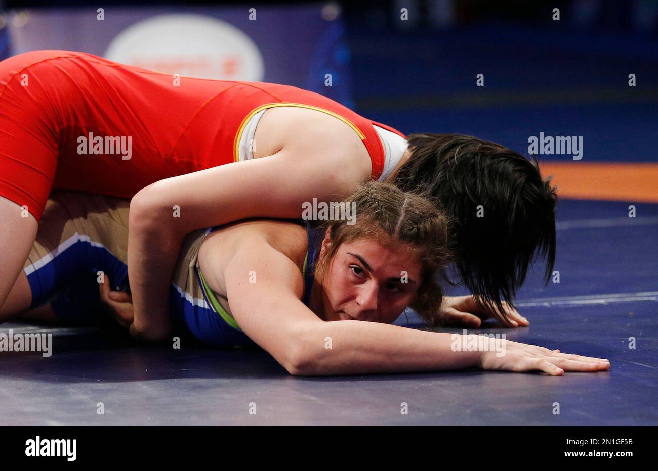 Natalia Vorobeva, bottom, of Russia, wrestles with Zhou Feng, of China ...