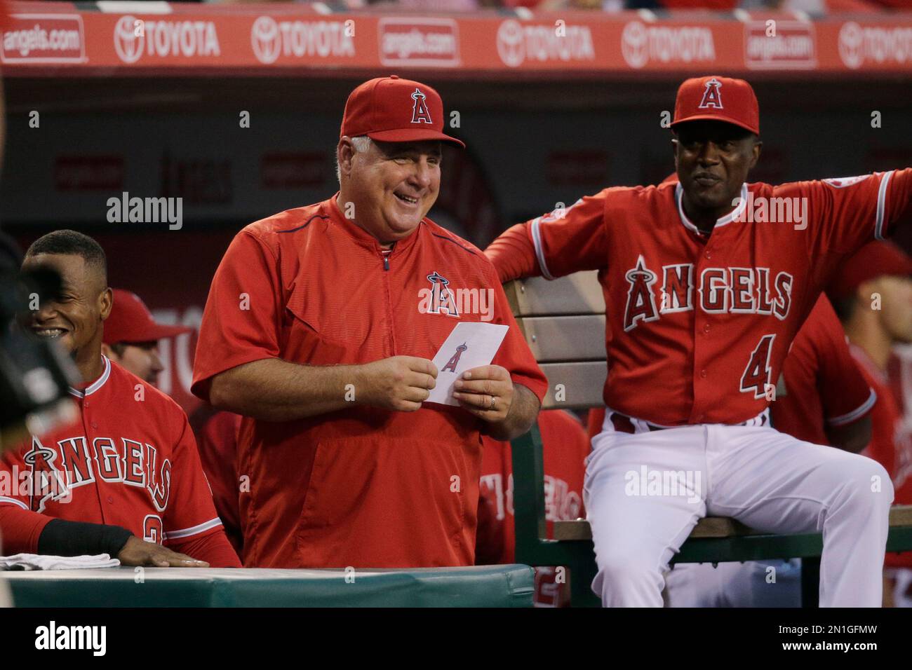 Los Angeles Angels Manager Mike Scioscia Center Smiles In The Dugout