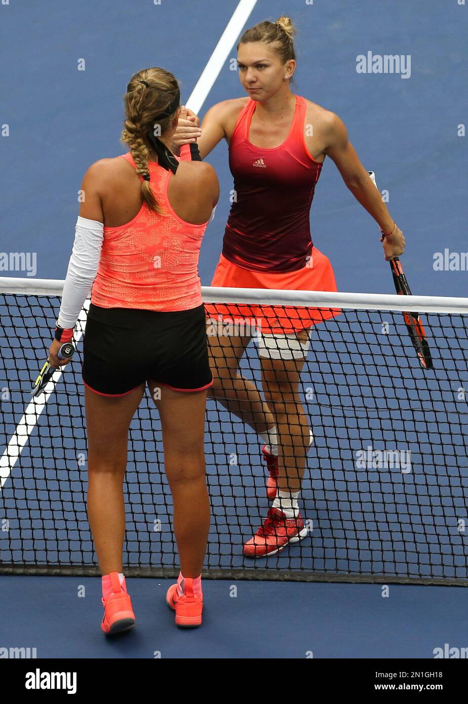 Simona Halep, of Romania, right, shakes hands with Victoria Azarenka ...