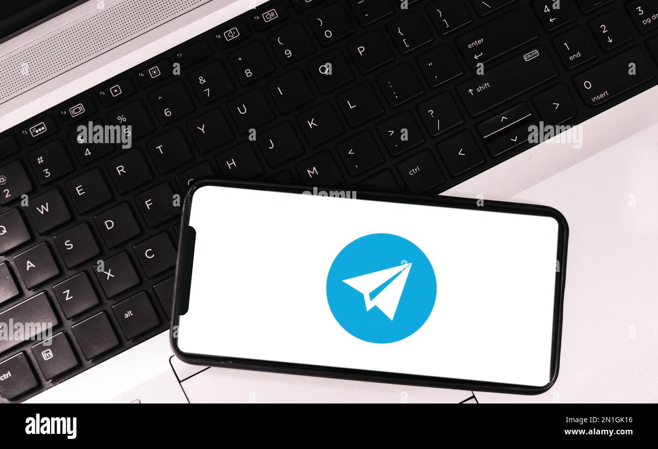 Telegram mobile application with laptop in the backdrop, editorial ...
