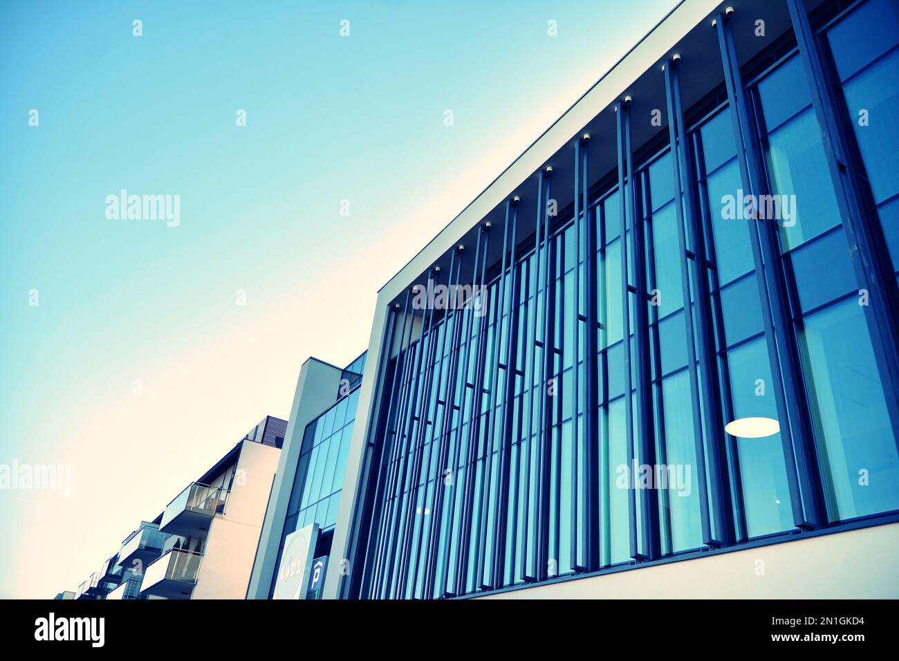 Modern office building on a clear sky background. Retro stylized ...