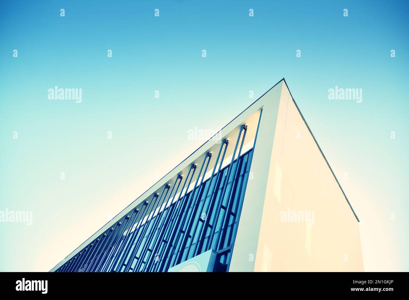 Modern office building on a clear sky background. Retro stylized ...
