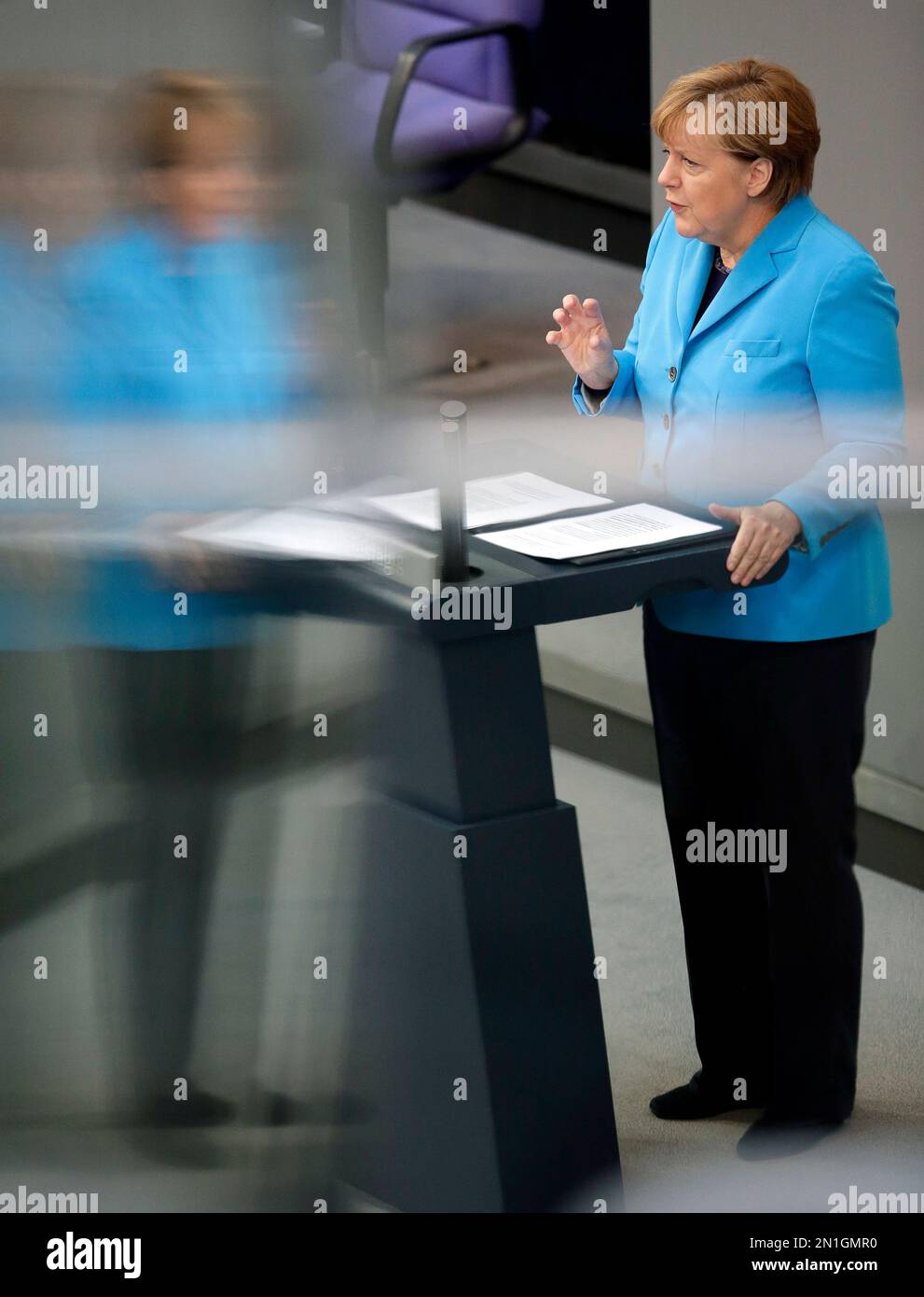 German Chancellor Angela Merkel gestures during her speech as part of a ...