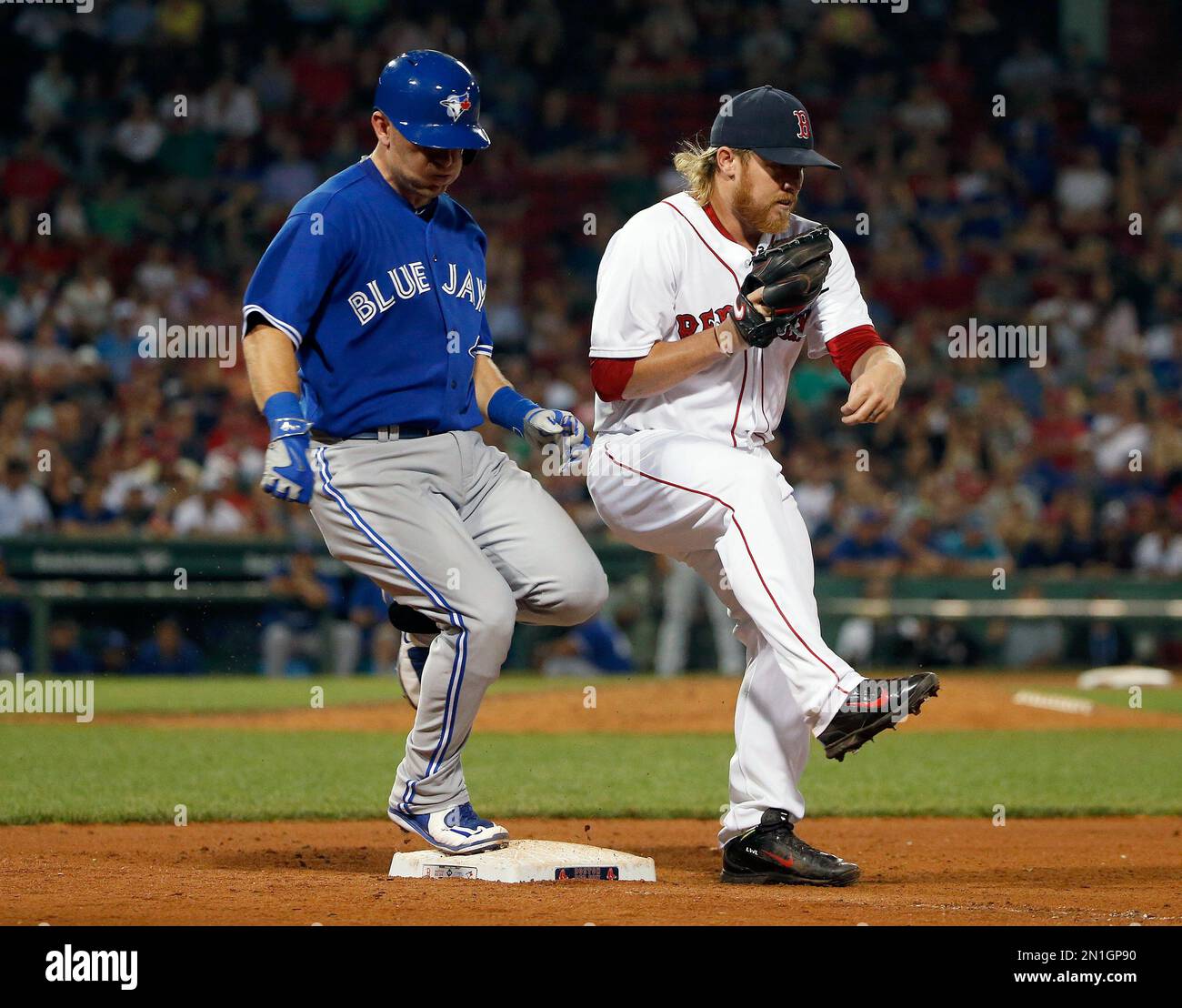 Toronto Blue Jays' Cliff Pennington, left, can not beat the throw to ...