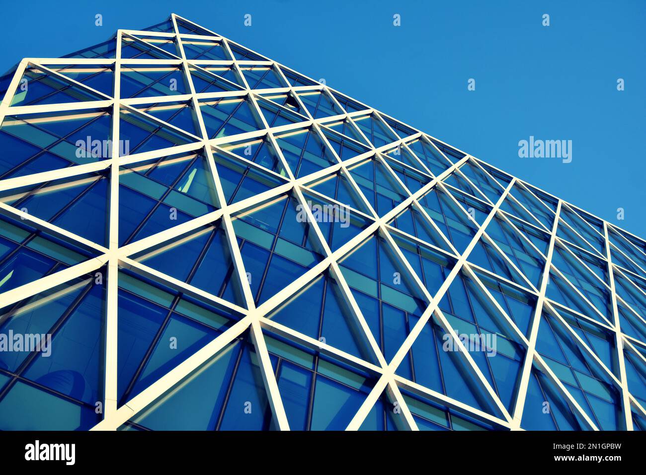 Modern office building on a clear sky background. Retro stylized ...