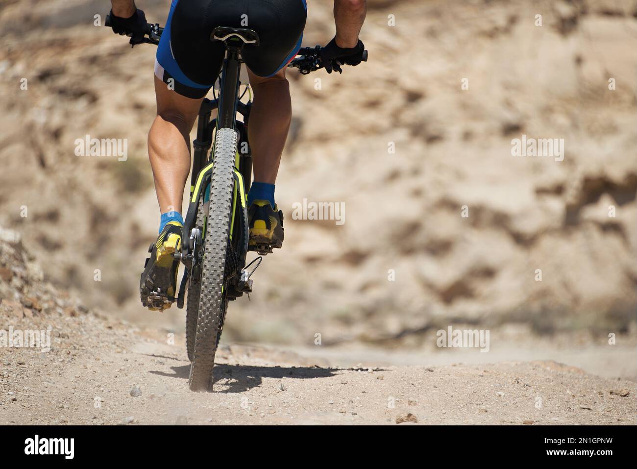 Mountain bike sport athlete man on a mountain bike trails on rocky ...