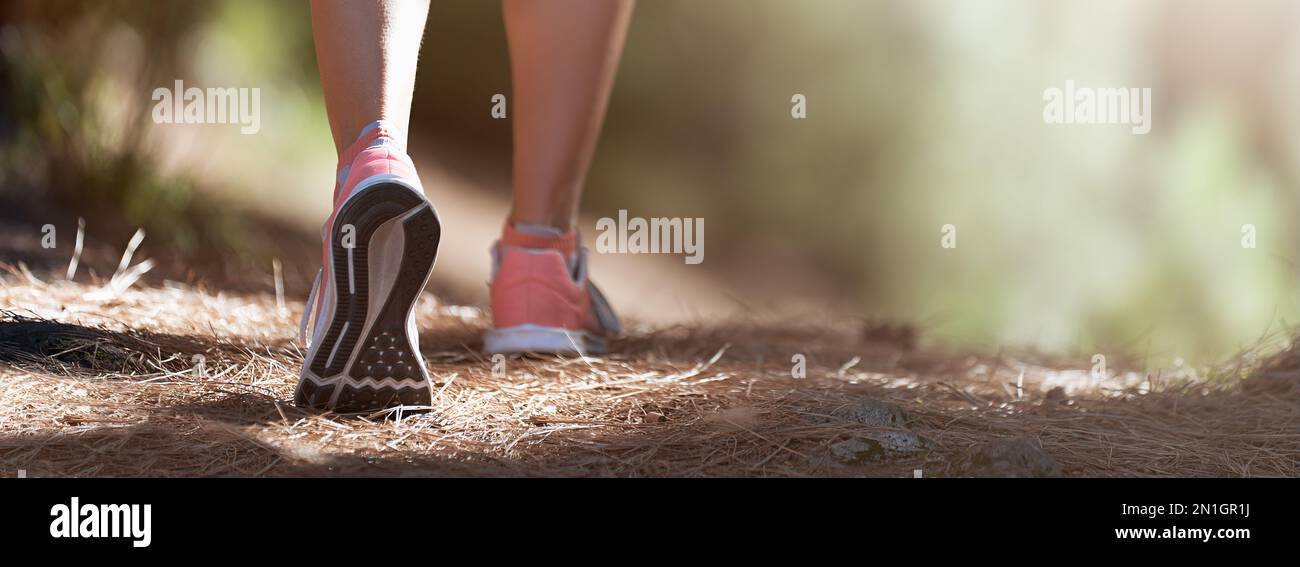 Athlete woman running at forest track, detail running shoes Stock Photo ...