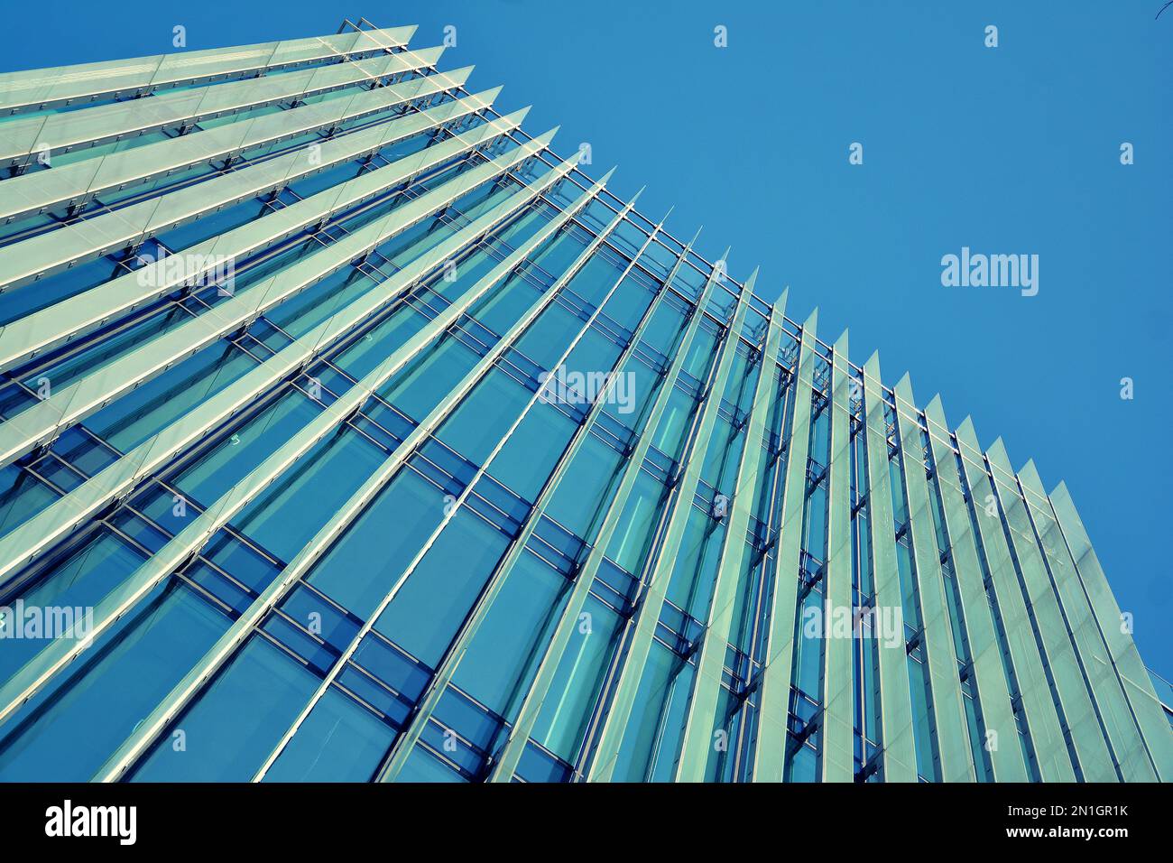 Modern office building on a clear sky background. Retro stylized ...